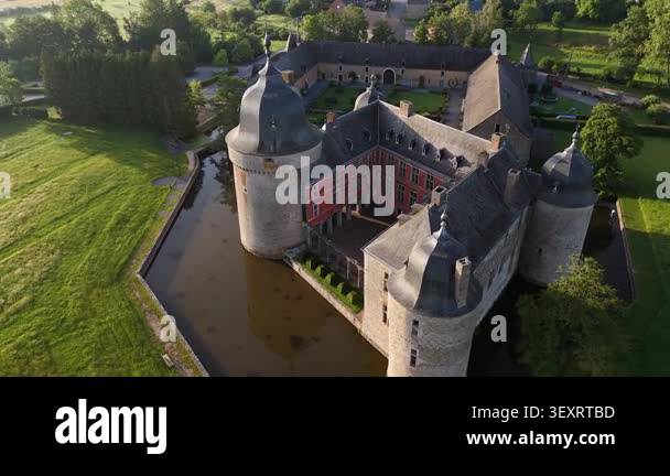 Aerial perspective of a moated chateau in the Belgium Ardennes. Early ...