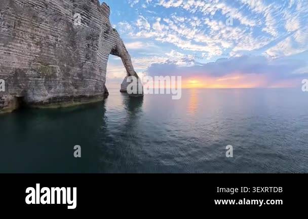 Stunning sunrise at Etretat France showcases natural chalk cliffs grand ...