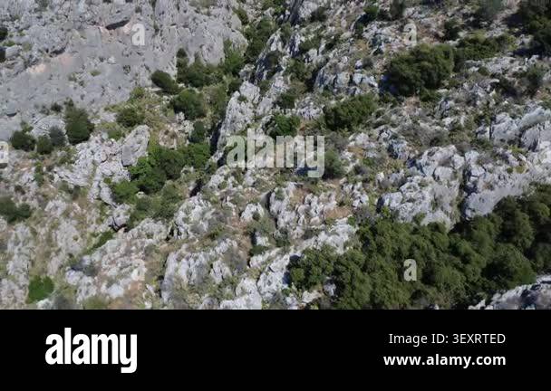 Aerial panorama of a dramatic gorge surrounded by rugged mountains and ...