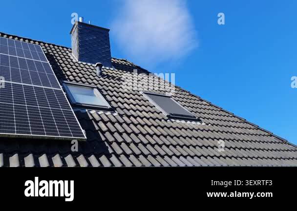 Solar panels on a house roof generating clean and renewable energy from ...
