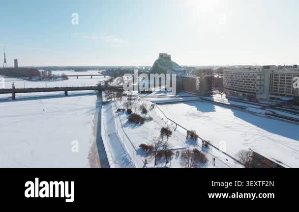 Aerial view of frozen Daugava in Riga with people walking, ski tracks ...