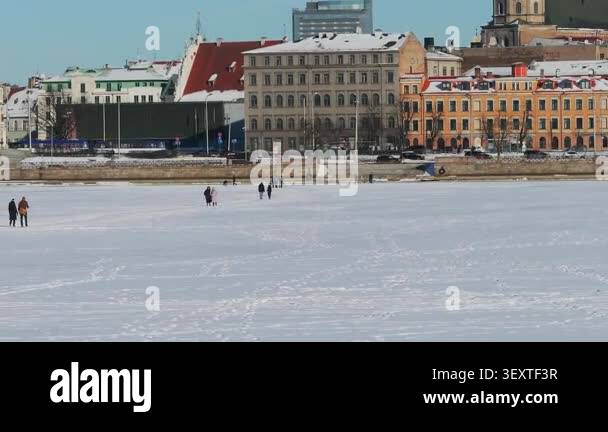Riga Old Town embankment and Radisson Blu tower stand beyond the frozen ...