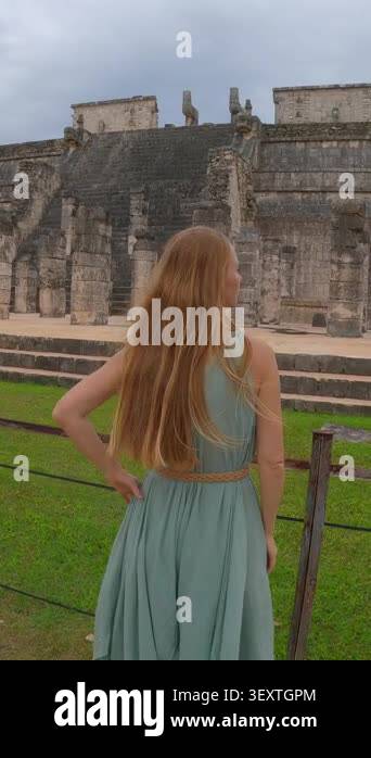 Woman tourist standing in front of Temple of the Warriors in Chichen ...