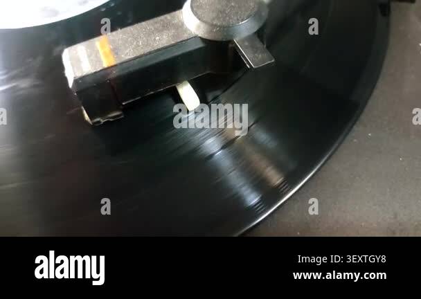Old vinyl record player spinning retro music disc in vintage style ...