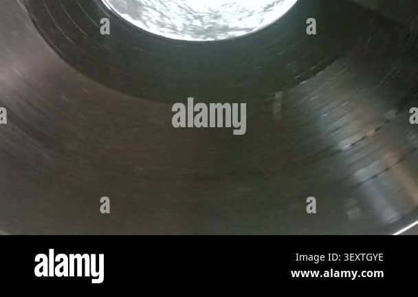 Old vinyl record player spinning retro music disc in vintage style ...