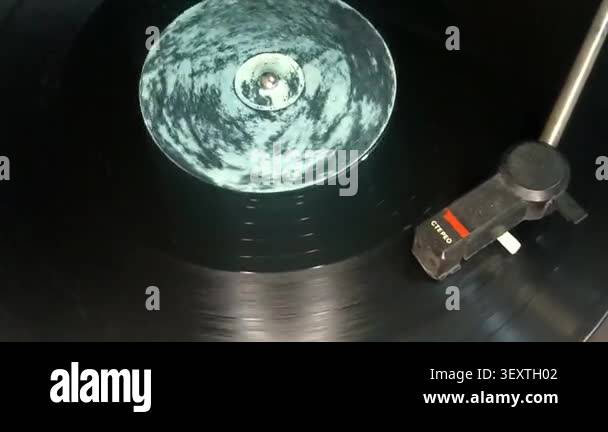 Old vinyl record player spinning retro music disc in vintage style ...