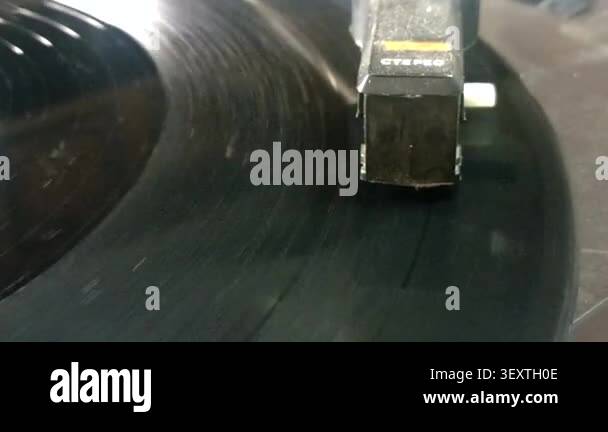Old vinyl record player spinning retro music disc in vintage style ...