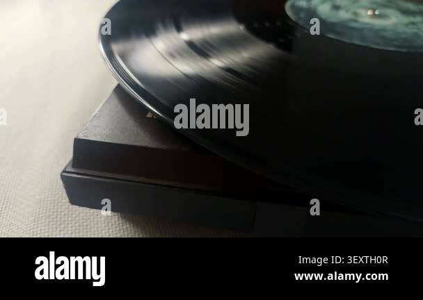 Old vinyl record player spinning retro music disc in vintage style ...