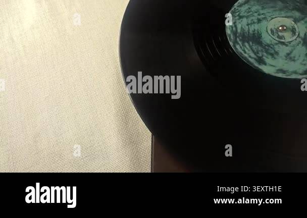 Old vinyl record player spinning retro music disc in vintage style ...
