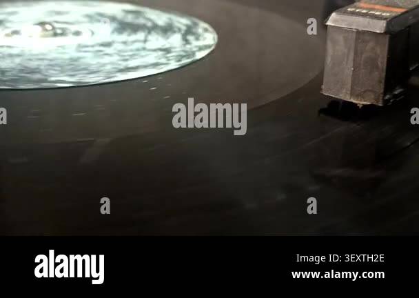 Old vinyl record player spinning retro music disc in vintage style ...