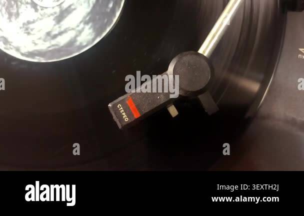Old vinyl record player spinning retro music disc in vintage style ...