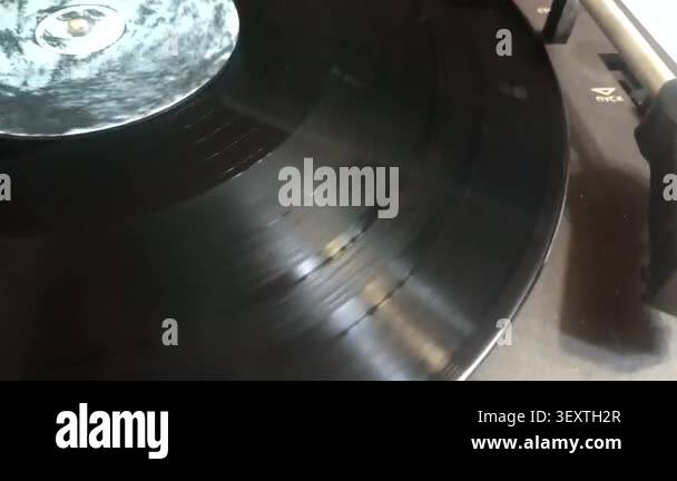 Old vinyl record player spinning retro music disc in vintage style ...