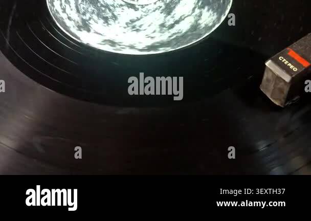 Old vinyl record player spinning retro music disc in vintage style ...