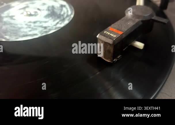 Old vinyl record player spinning retro music disc in vintage style ...