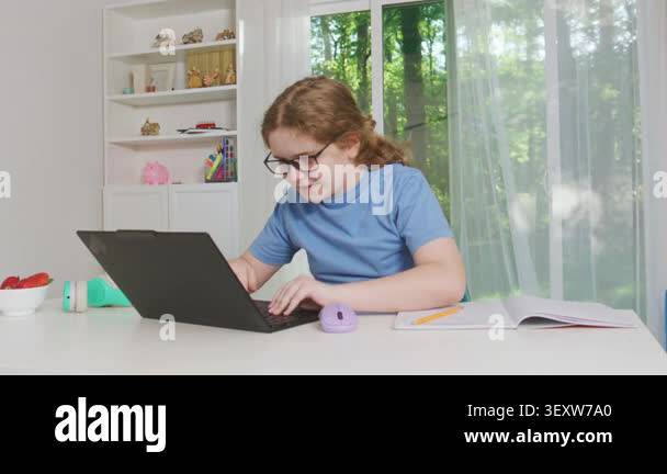 Online school kid with laptop screen. Child attends online school at ...