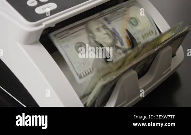 Hundred dollar bills moving through counting machine. Money counting ...