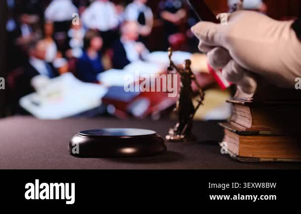 American judges hand hitting a gavel, concluding a court case and ...