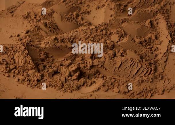 Rotating brown cocoa powder background for culinary video projects ...