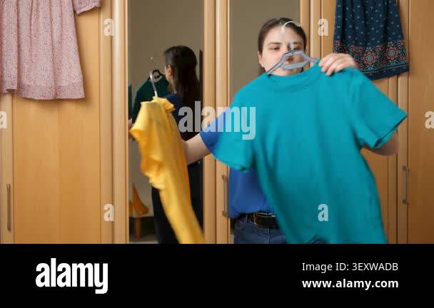 Beautiful woman deciding what to wear based on seasonal color theory ...