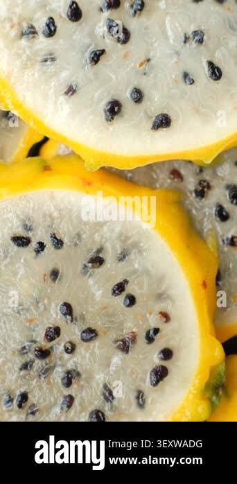 Slices of yellow dragon fruit texture background top view Stock Video ...