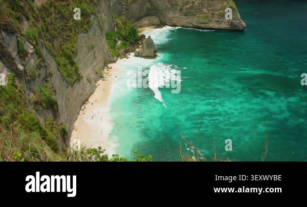 Tourists Relax On White Sand Under Massive Limestone Cliffs At Diamond ...