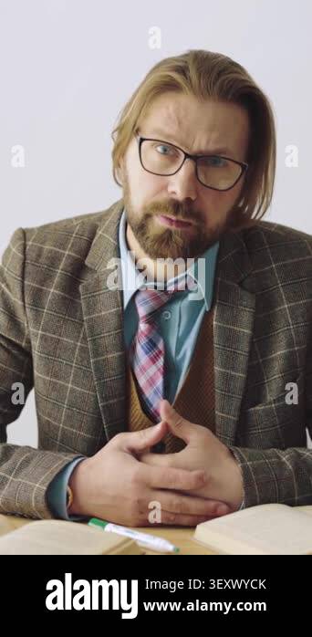 Man with glasses shows focus while listening to different ideas at a ...