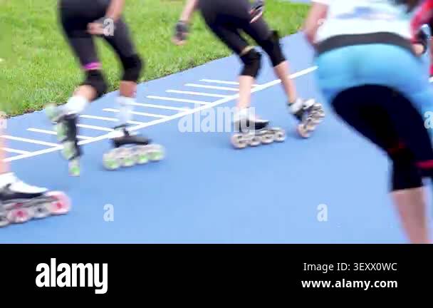 Action shot with motion blur showing the legs and skates of speed ...