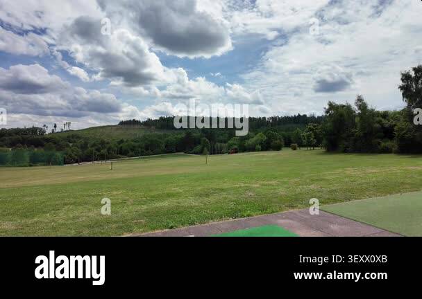 Wide angle landscape of a beautiful green grass field or golf course ...