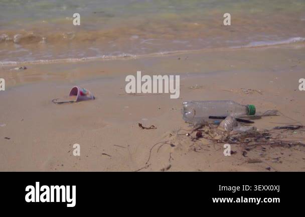 Close Up of Plastic Bottles and Beach Litter on Sandy Shore ...