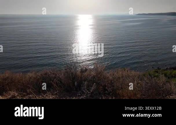 SBeautiful high angle scenery of a calm sea with a bright sun ...