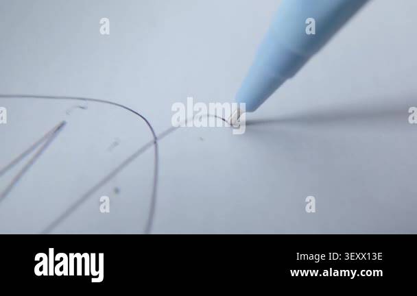 Macro of a Pen Tip Drawing Freehand Lines on White Paper, Showcasing ...