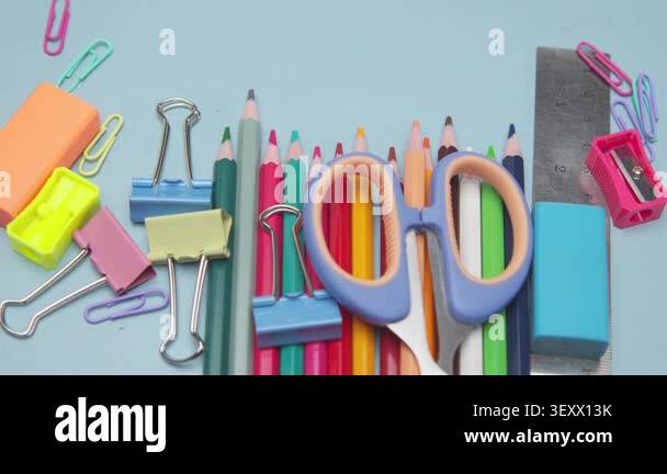 Flat Lay of Colorful School Supplies on a Blue Background with Copy ...