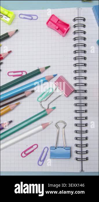 Back to School Stationery Layout with an Exercise Book, Colored Pencils ...