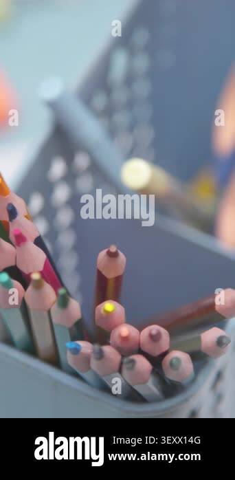 Close Up of a Hand Taking Colored Pencils from a Light Blue Pencil Case ...
