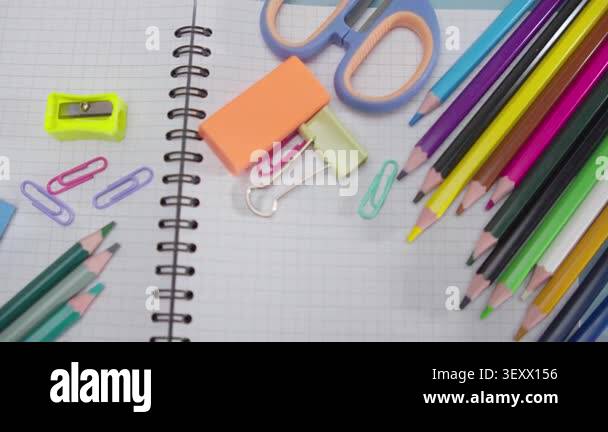 Colorful Back to School Supplies Arranged Around an Open Exercise Book ...