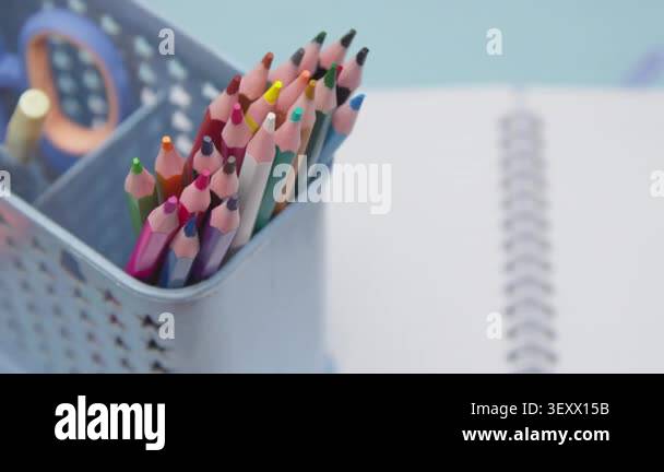 Close Up of a Hand Placing Colored Pencils Back into a Pencil Case ...
