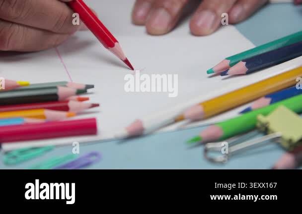 Creating an Abstract Sketch with Colored Pencils on White Paper ...