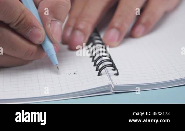 Close Up of a Pen Writing Basic Math Problems in an Exercise Book ...