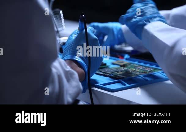 technician in protective mask and gloves repairing computer Stock Video ...