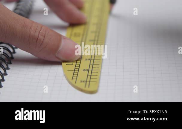 Extreme Close Up of Drawing a Straight Line with a Pencil and Ruler on ...