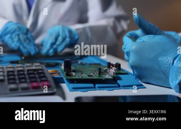 close - up of male technician holding a computer circuit board Stock ...