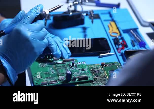 technician working in a repair shop Stock Video Footage - Alamy