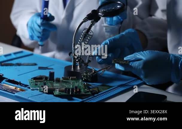 technician repairing electronic computer circuit board Stock Video ...