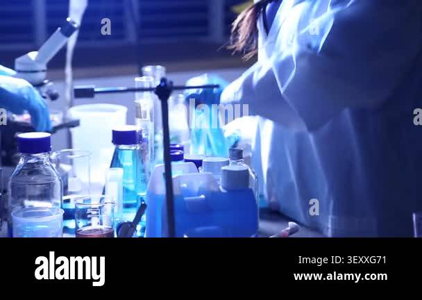 laboratory worker with a microscope in the laboratory Stock Video ...