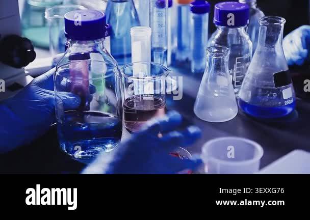 laboratory glassware with liquid Stock Video Footage - Alamy