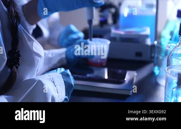 laboratory scientist in blue gloves and blue liquid Stock Video Footage ...