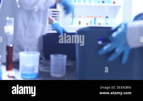 close up of laboratory assistant holding flask Stock Video Footage - Alamy