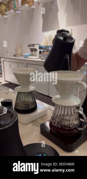 Close up of specialty coffee brewing process using two V60 ceramic ...