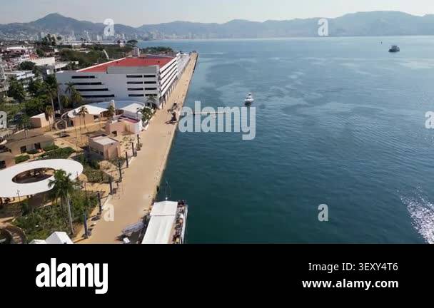 Aerial drone footage moving forward above Acapulco maritime terminal ...
