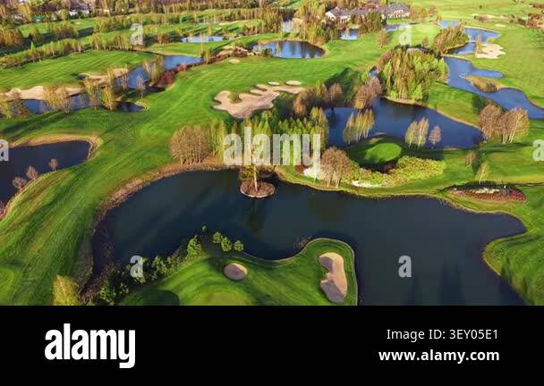 Sunny summer day over golf course and forest Stock Video Footage - Alamy